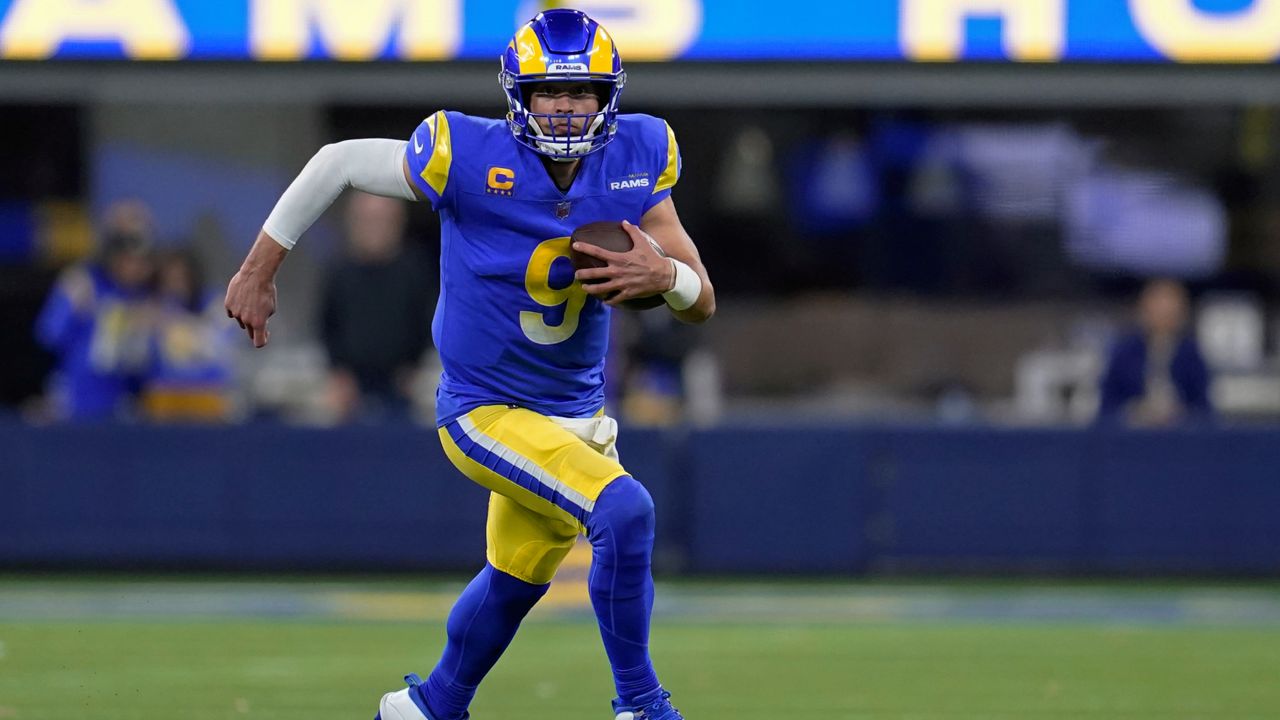 Stafford propels Rams past Cardinals 34-11 in playoff rout