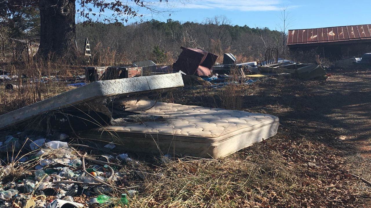 People illegally using abandoned property as dump site