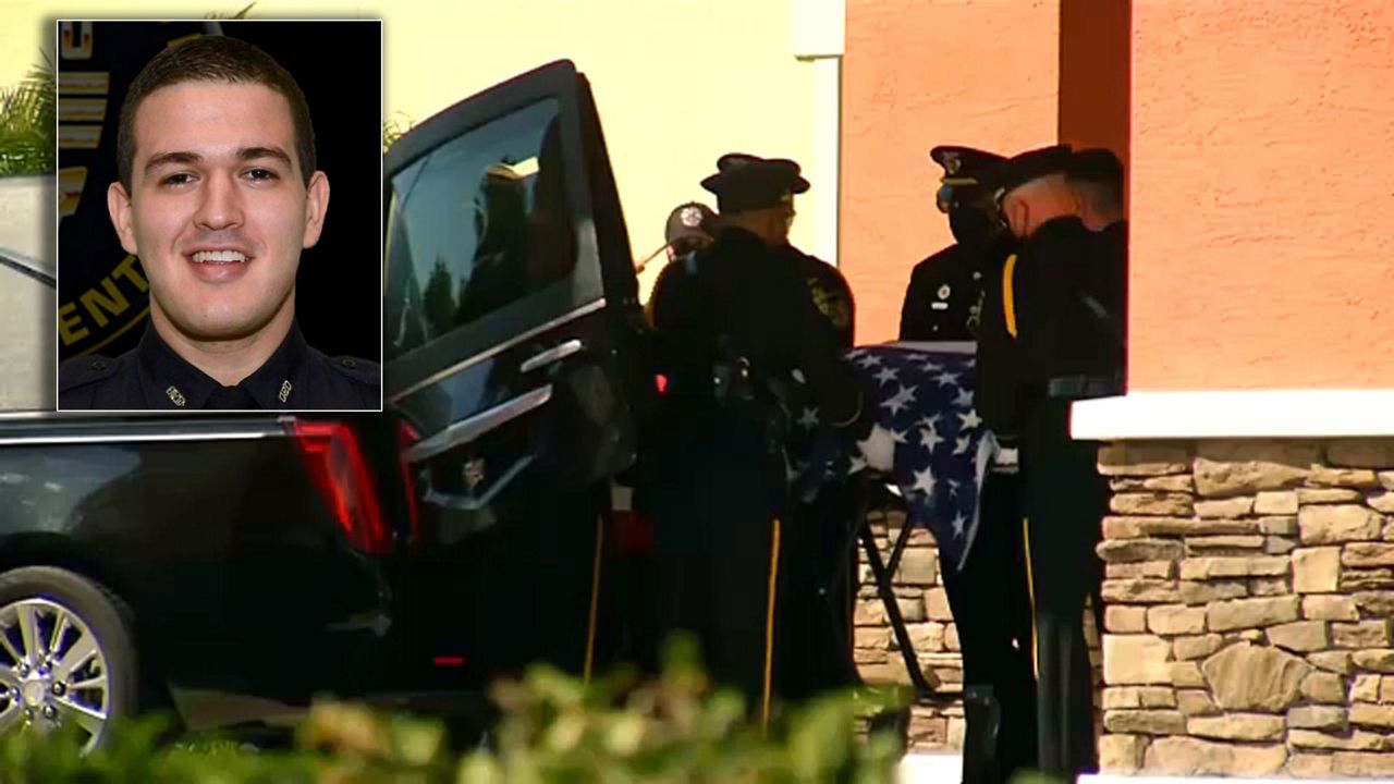 Grieving Police Officers Guide Kevin Valencia's Body to Orlando