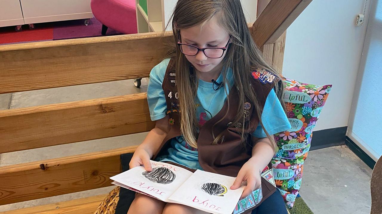 Ocala Girl Scout gets badge from out of this world