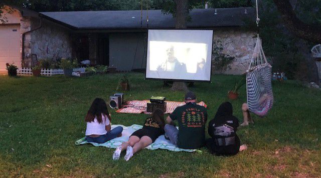 Families Enjoy Big Screen Movie Night Under the Stars in Their Front Yard