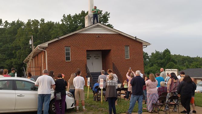 North Carolina Pastor Preaches Sermon from Church's Roof