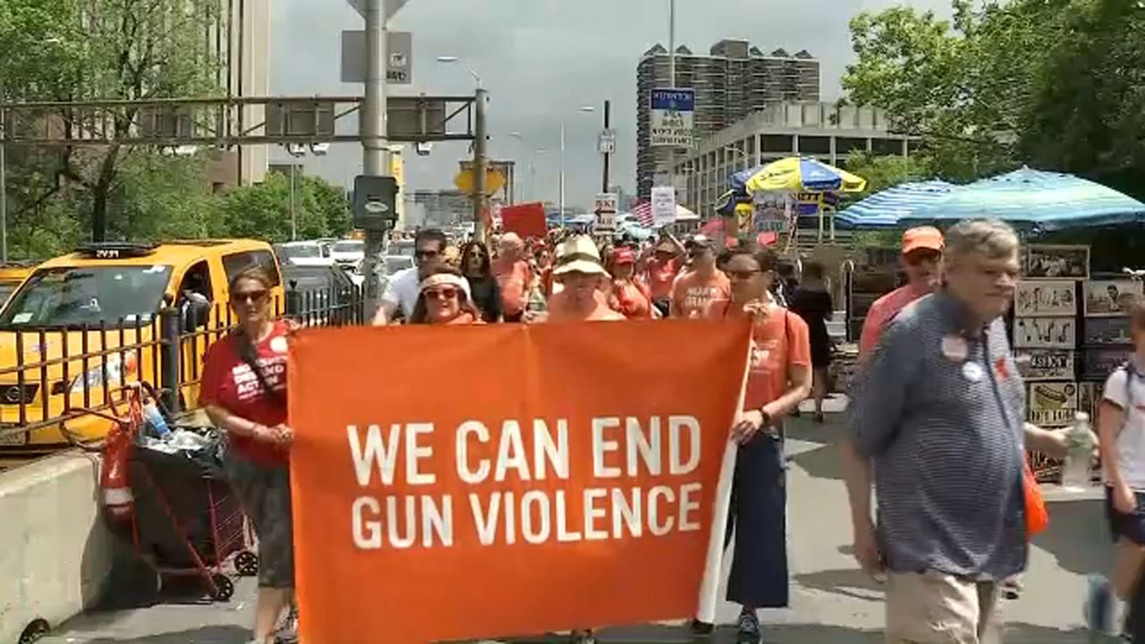 Rally against gun violence march across the Brooklyn Bridge