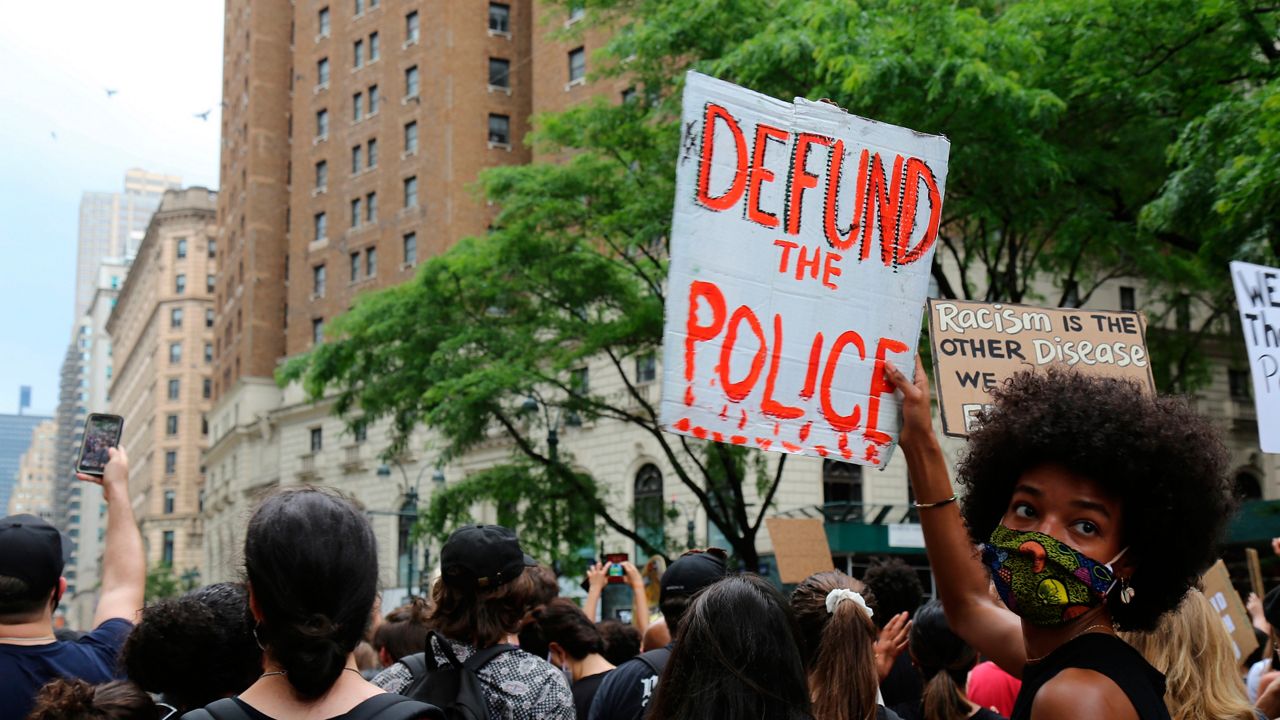 The Meaning Behind The Slogan "Defund The Police"
