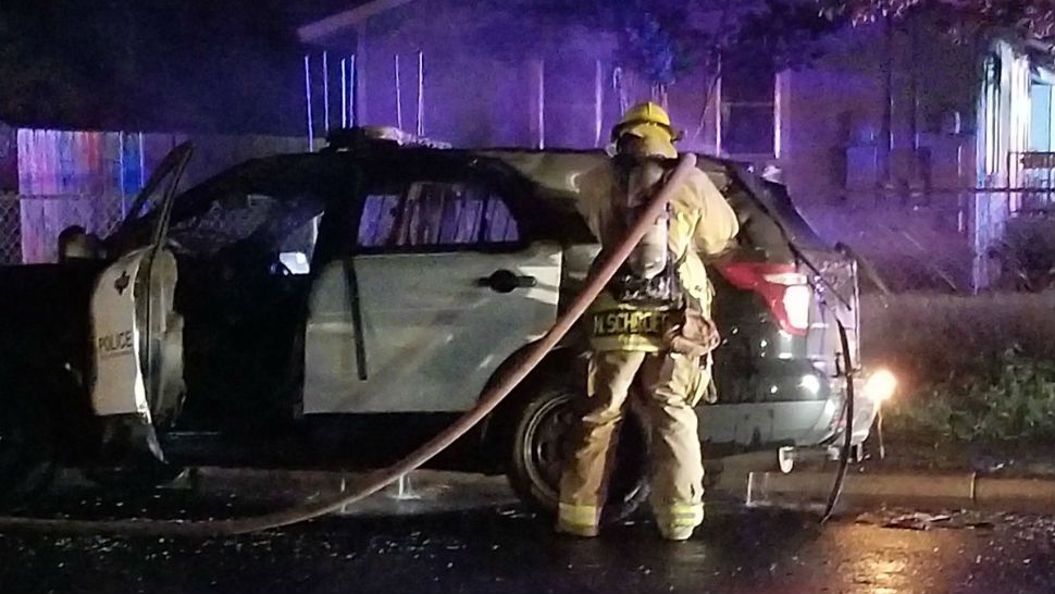 Officer injured as patrol car catches on fire