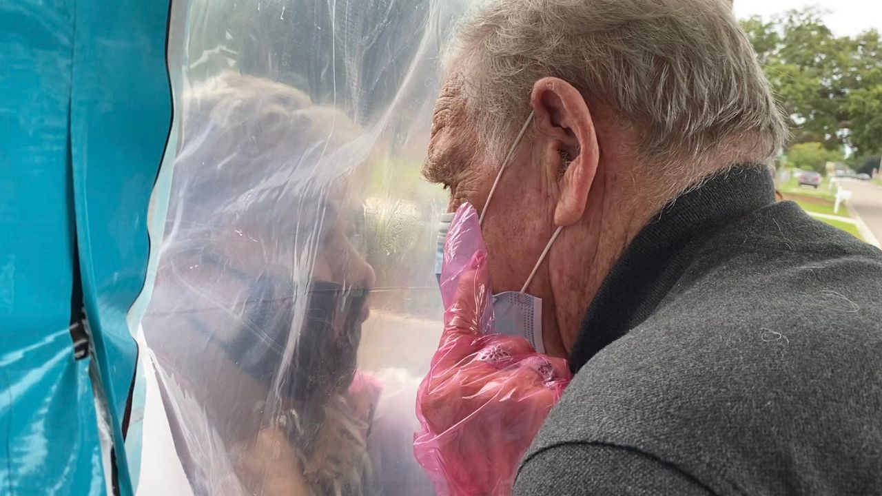 Hug Wall Helps Loved Ones Connect Amid COVID-19