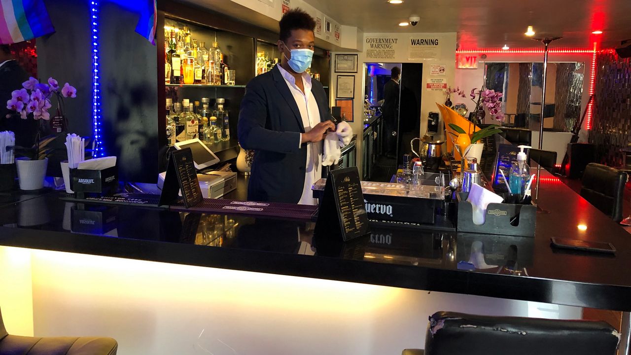 Alibi Lounge Harlem community NYC rallies after owner attacked bar robbed
