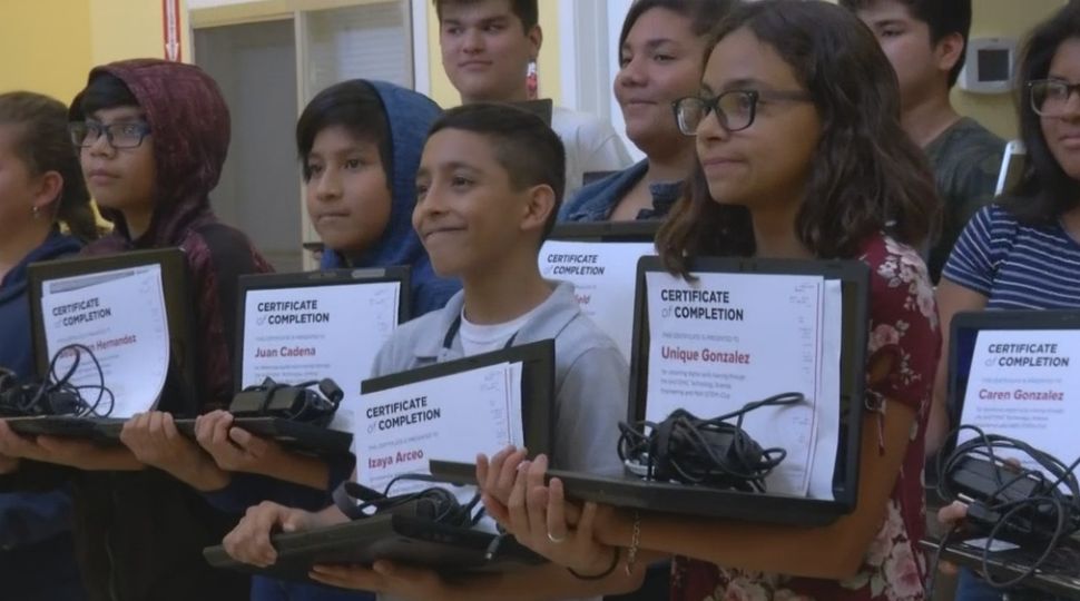 Low Income Students Receive Free Laptops for Schoolwork