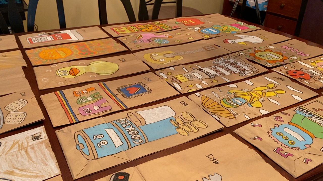 Lexington teacher crafts one paper bag puppet per day