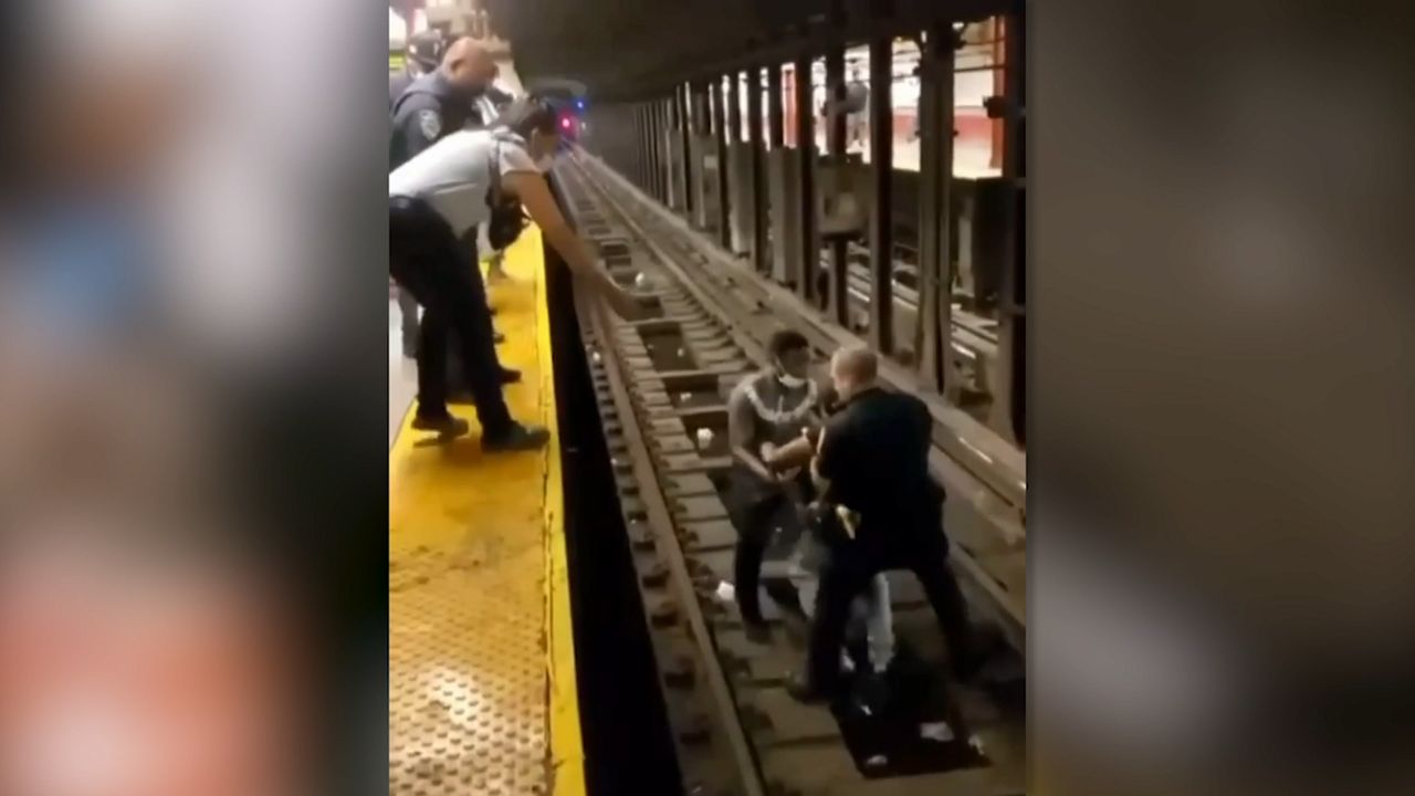 NYPD officer, good Samaritan rescue man on subway tracks
