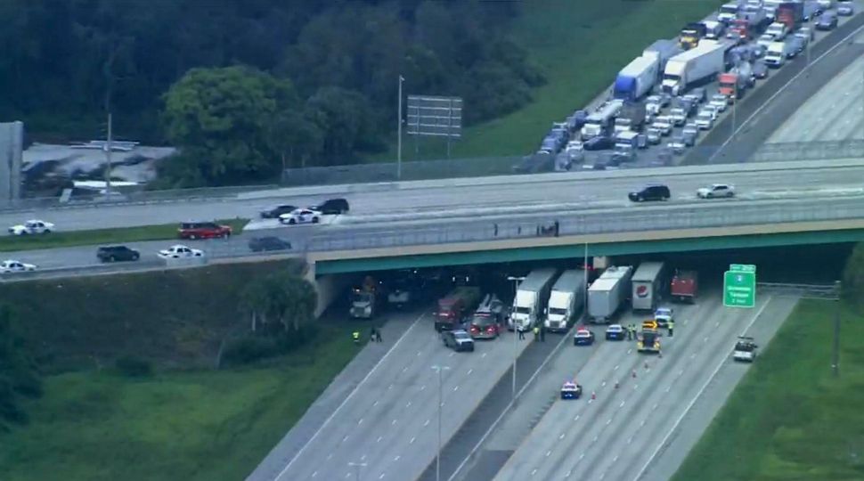 Florida's Turnpike reopens after man climbs overpass fence