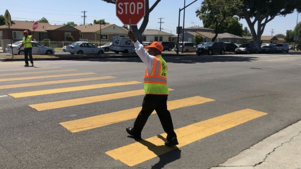 Crossing Guard Helping Students Get to School for 40 Years