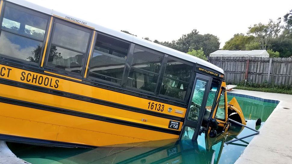 PHOTOS: Students Safe After School Bus Crashes Into Pool