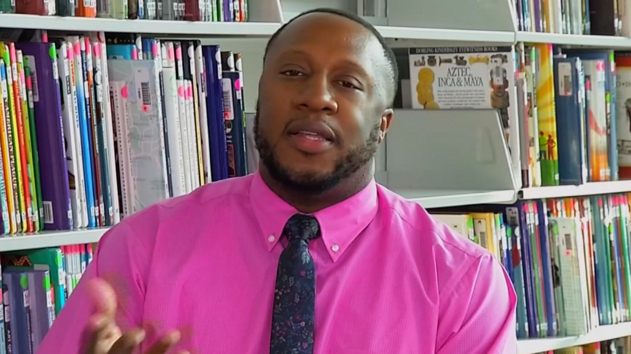 History Teacher Uses Past to Explain the Present