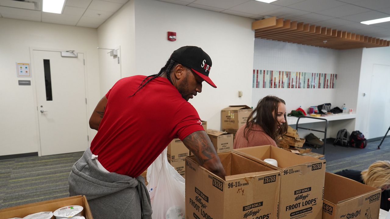 KFC employees assemble food for thousands of school children