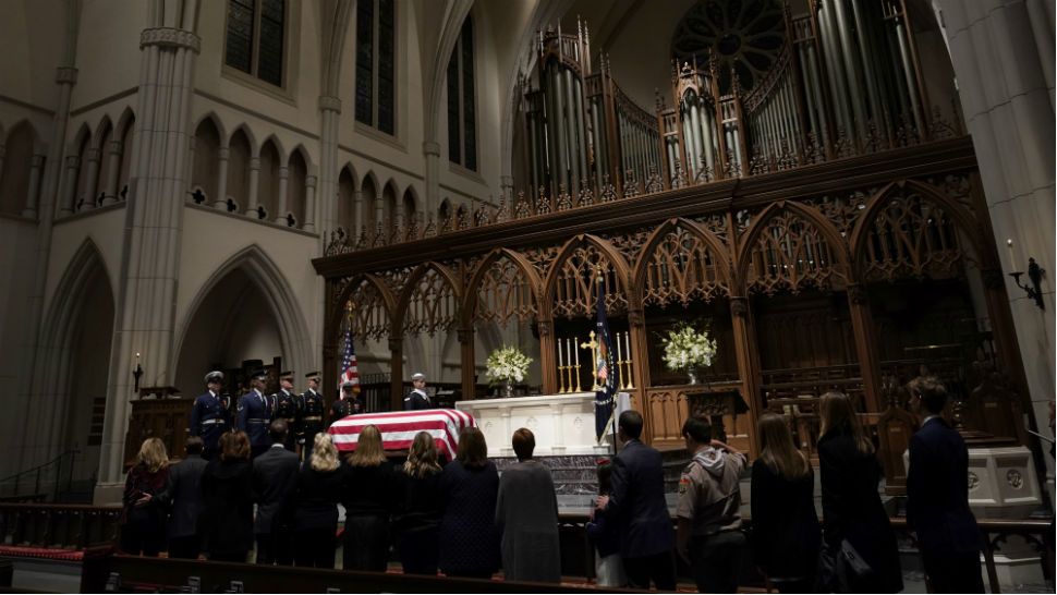 George HW Bush Takes Final Ride to Rest Alongside Barbara