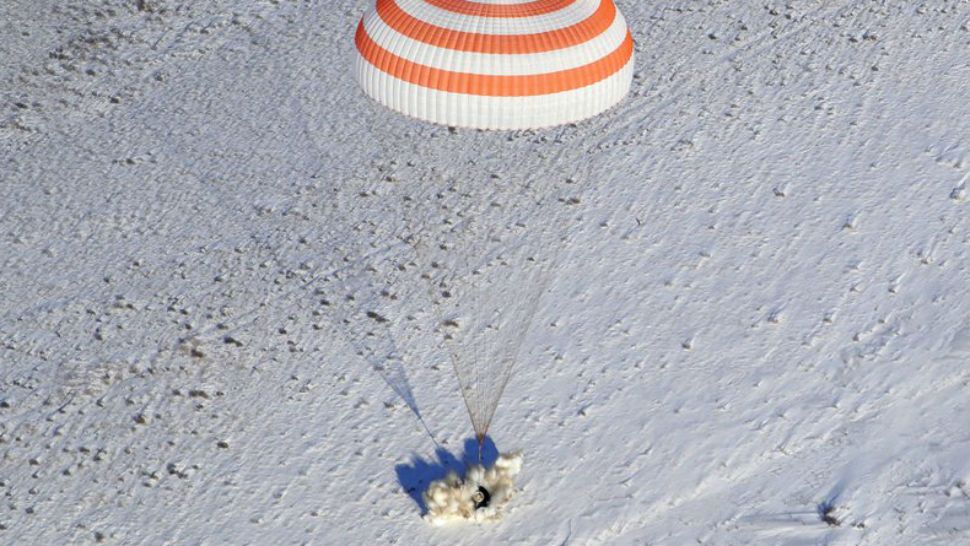 Space capsule with 3 astronauts returns to Earth