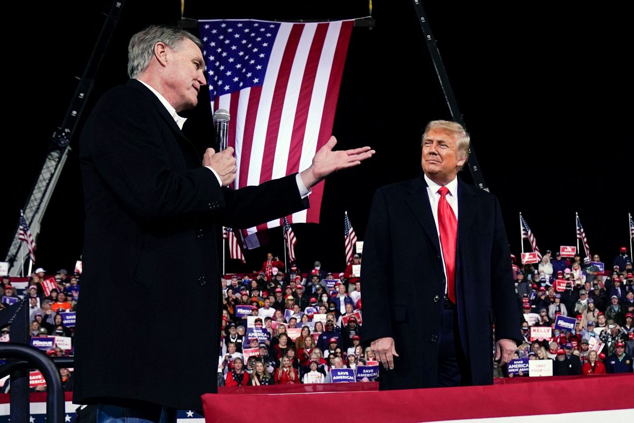 Perdue hugs Trump as he runs to right in Georgia GOP primary