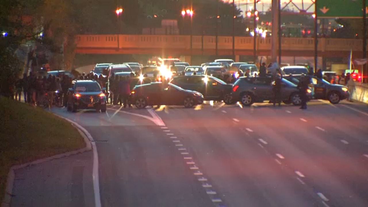 2 Charged After Protest Shuts Down Portion of I-490