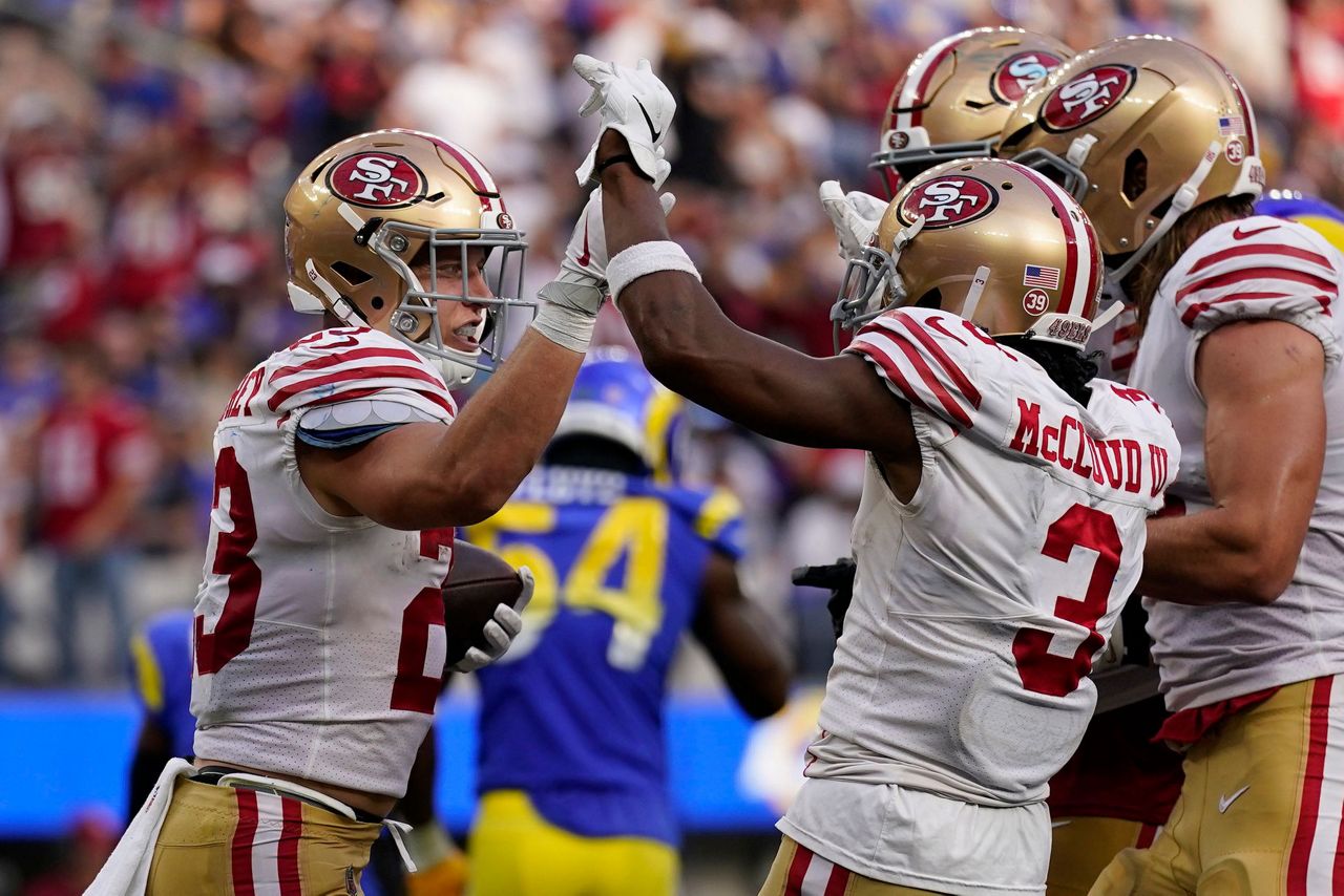 McCaffrey throws, catches, rushes for TDs, Niners rout Rams