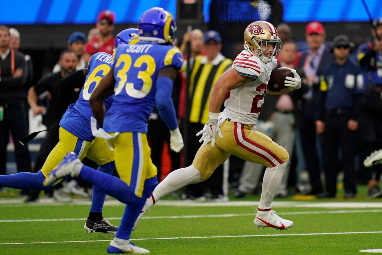 McCaffrey throws, catches, rushes for TDs, Niners rout Rams