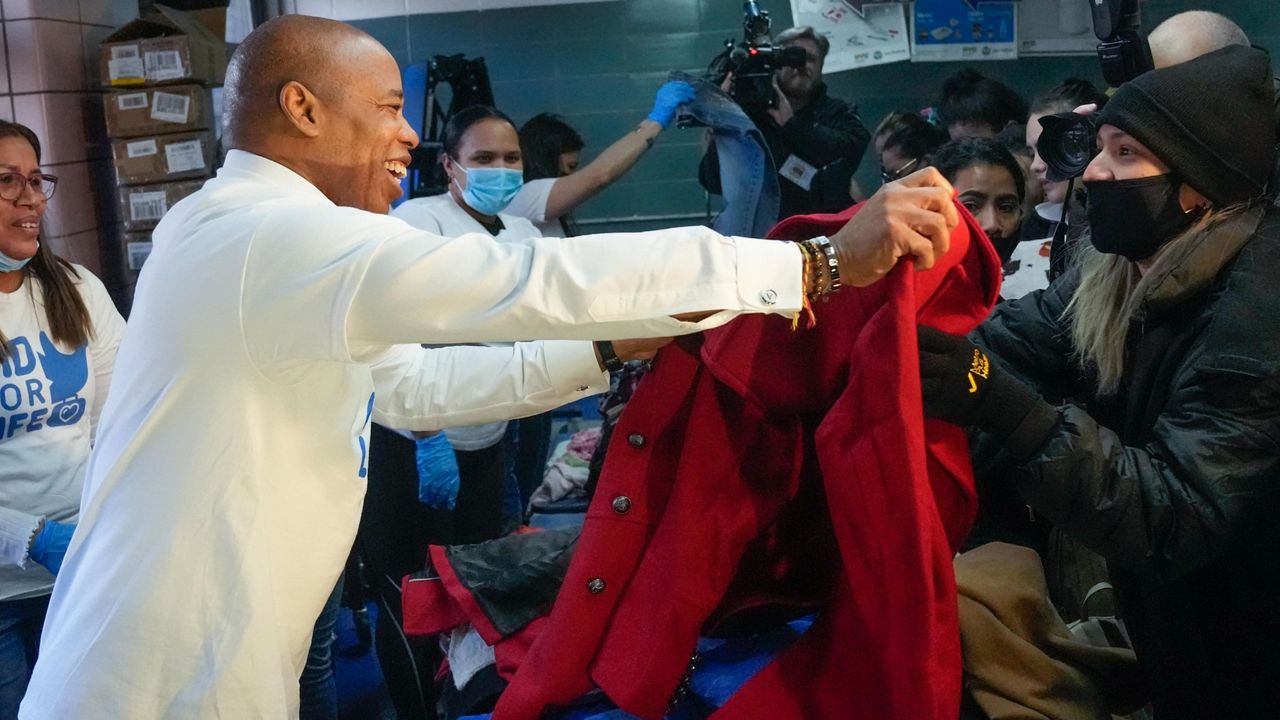 Hundreds of asylum seekers receive hot food and clothes