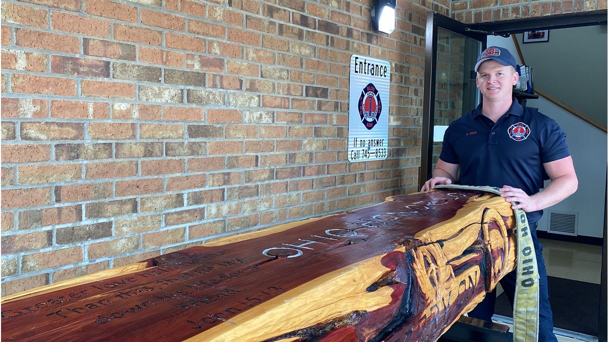 Firefighters use log the size of casket to honor victims