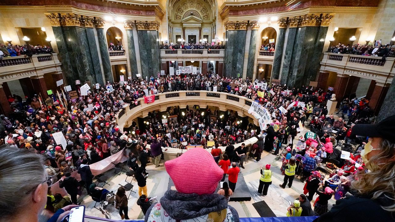 ‘Here again’: Abortion activists rally 50 years after Roe