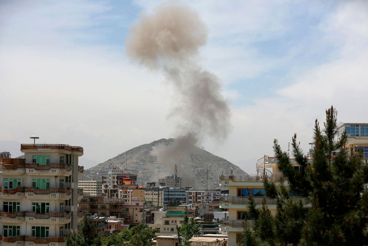 Afghan officials: Large explosion, gunfire in capital