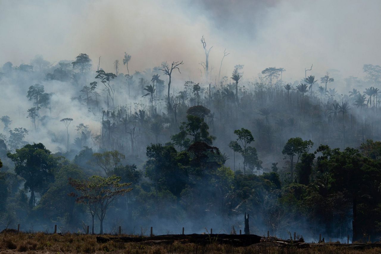 Brazilian firefighters toil in Amazon region hazy with smoke