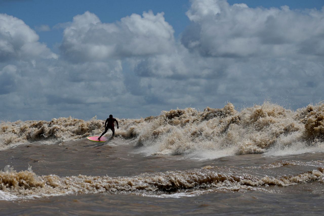 Surfers at Amazon's mouth ride some of world's longest-lasting waves