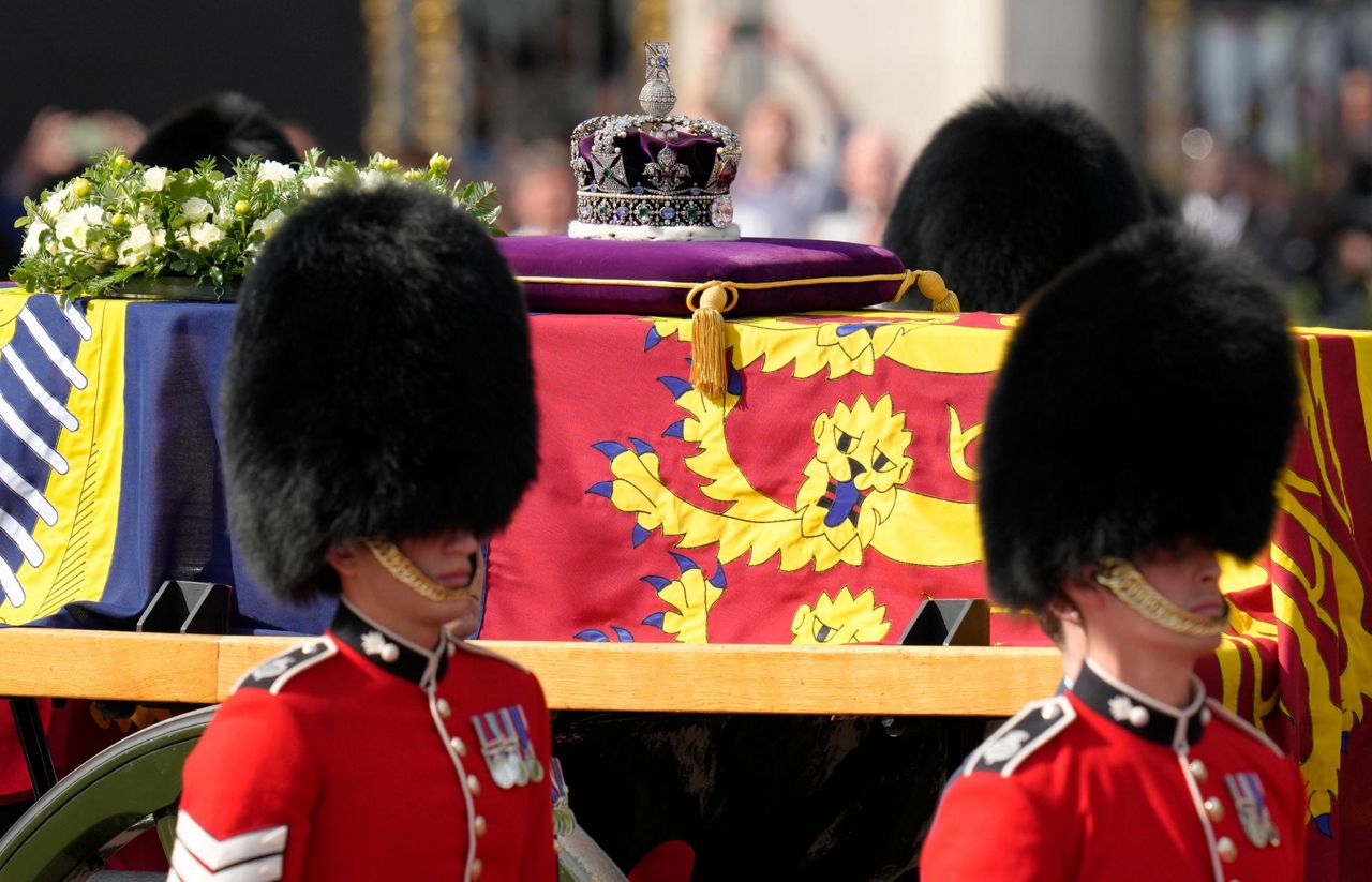Crowds gather in London to see queen's coffin procession