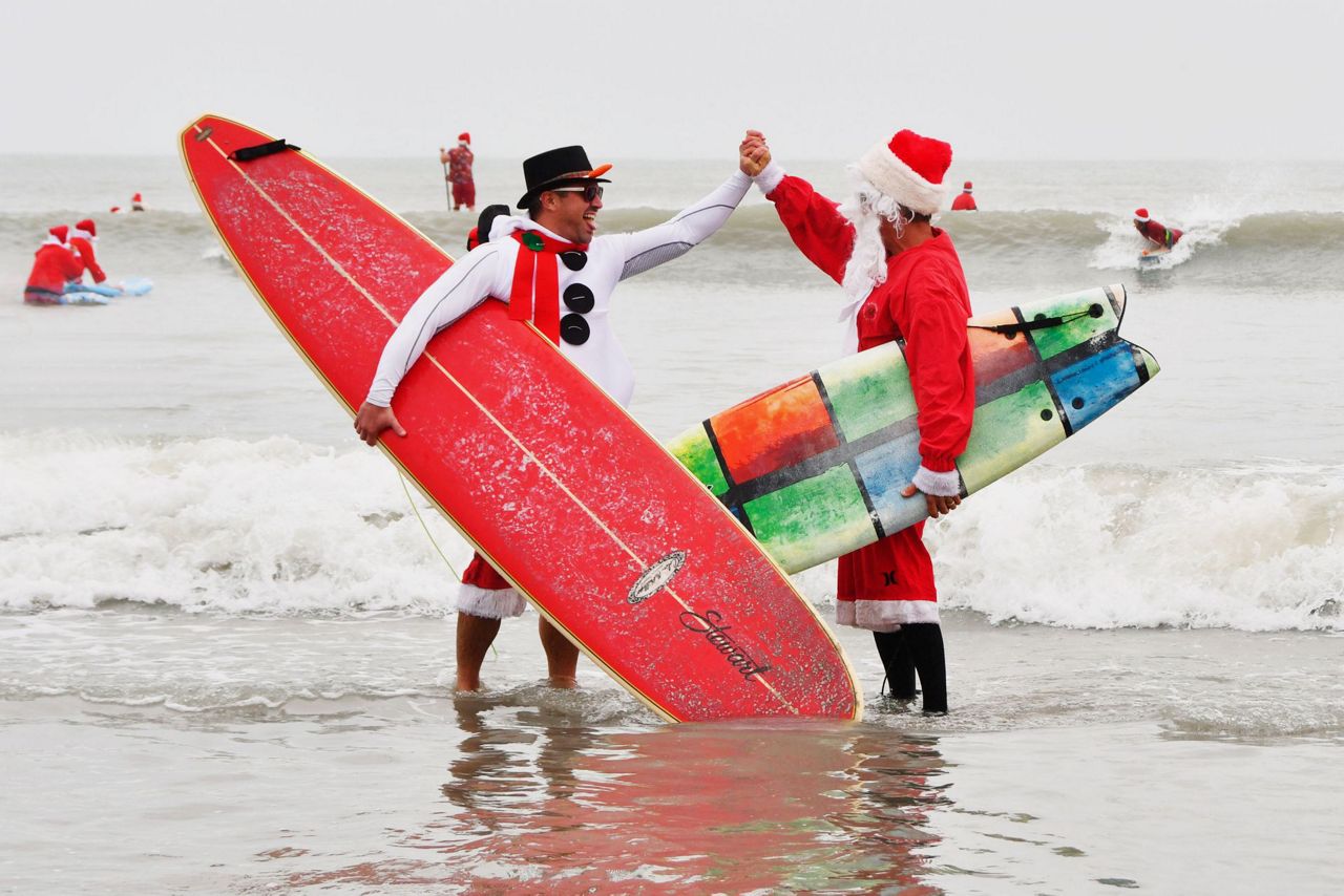 Surfing Santas ride waves along Florida's Space Coast