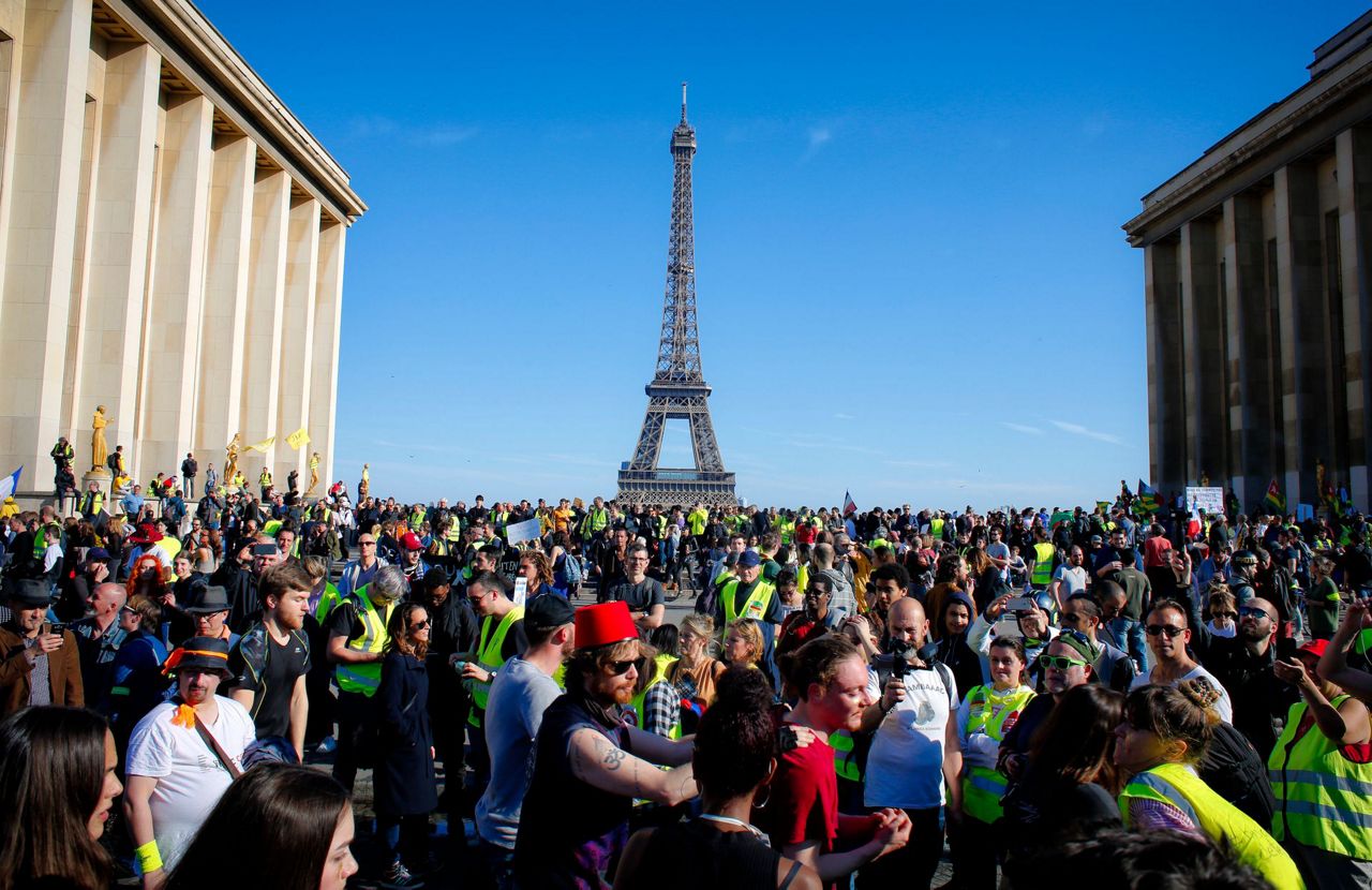 France's yellow vest protesters march despite bans, injuries