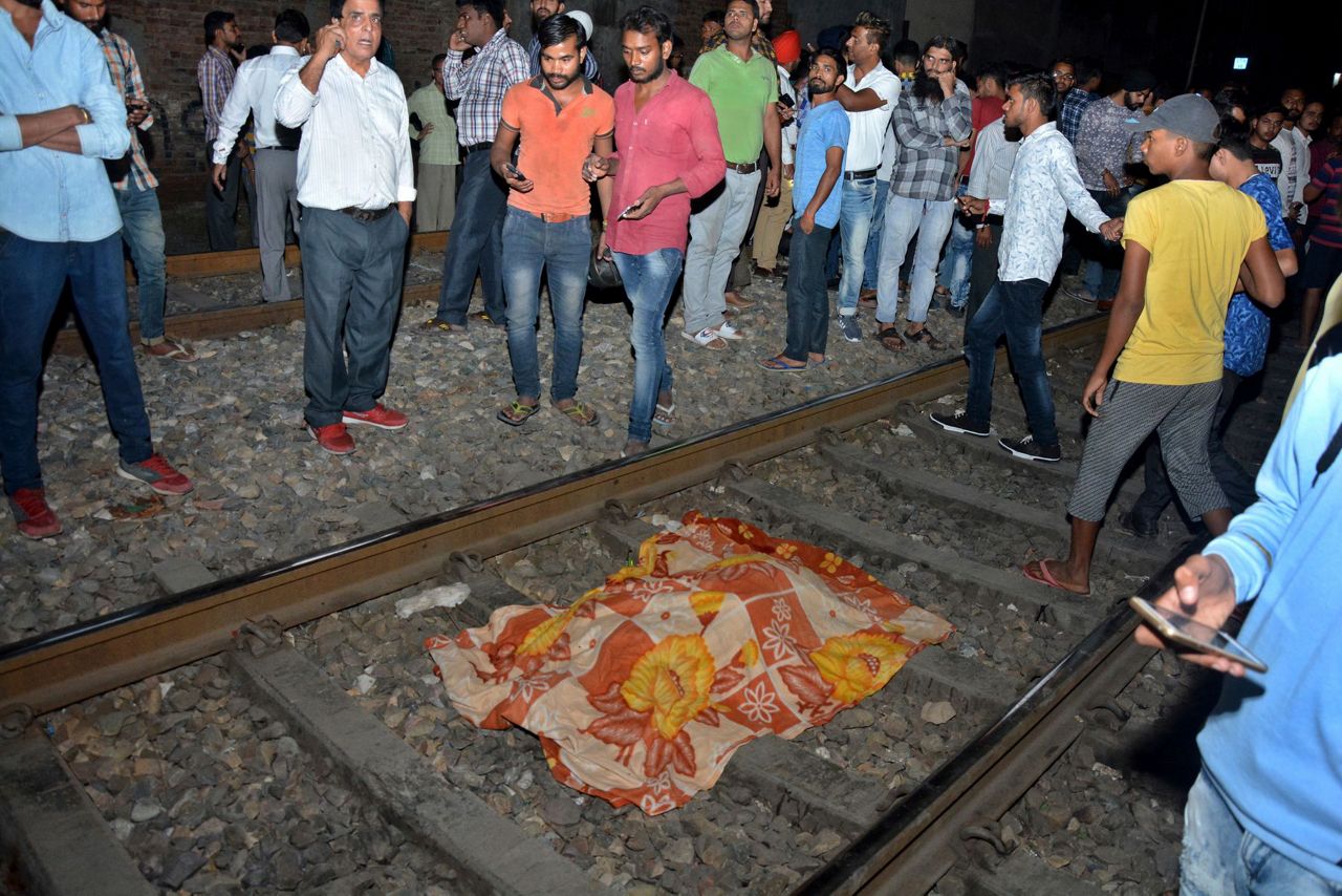 Train mows down crowd at India festival, at least 58 dead