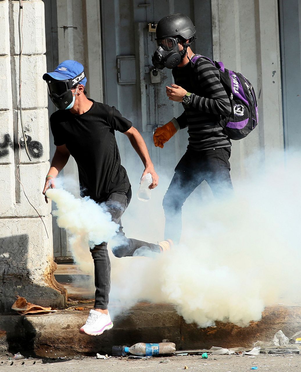 Iraqi officials: Protests cut port road, close central bank