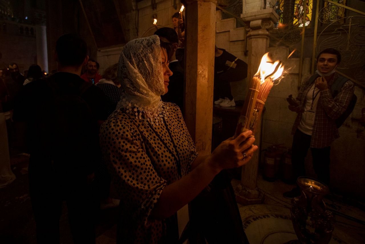 Vaccinated faithful throng Jerusalem church for Holy Fire