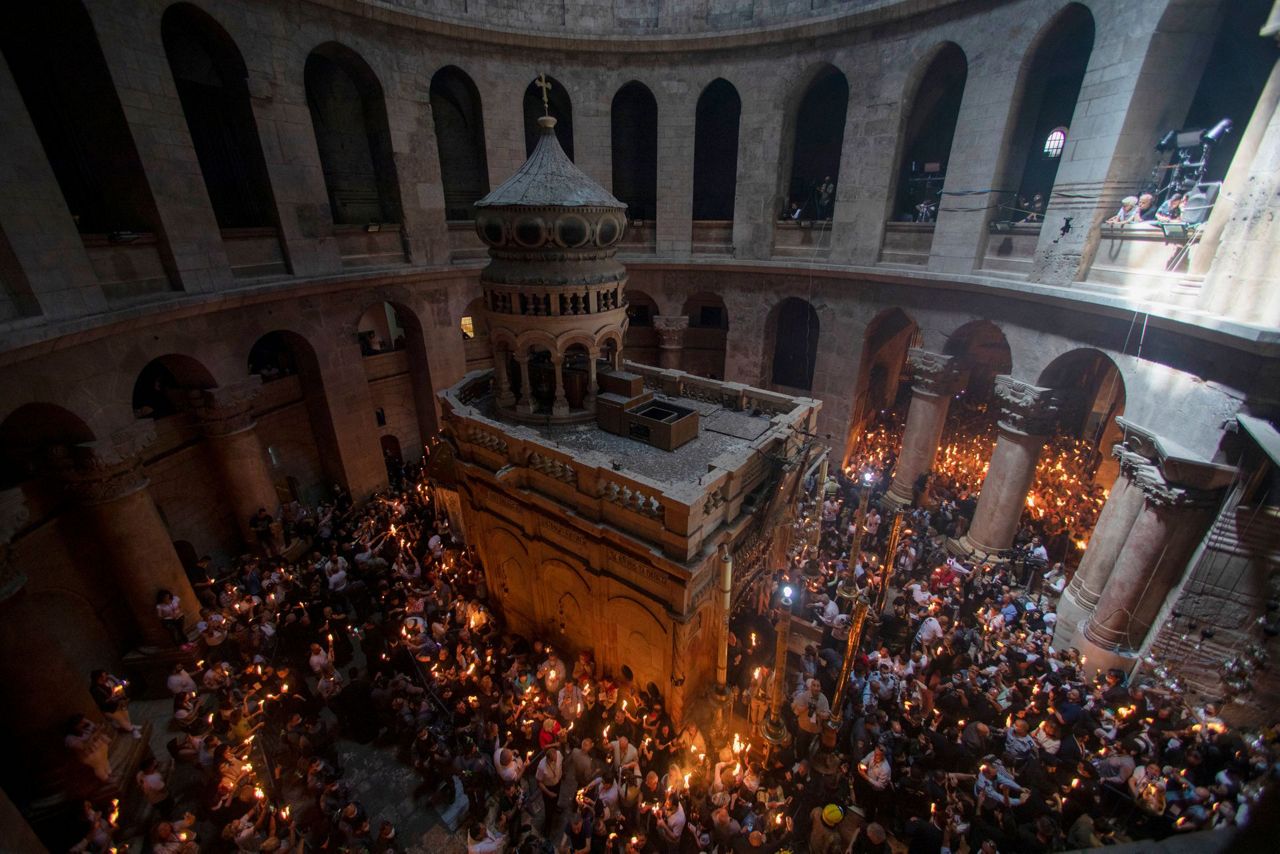 Vaccinated faithful throng Jerusalem church for Holy Fire