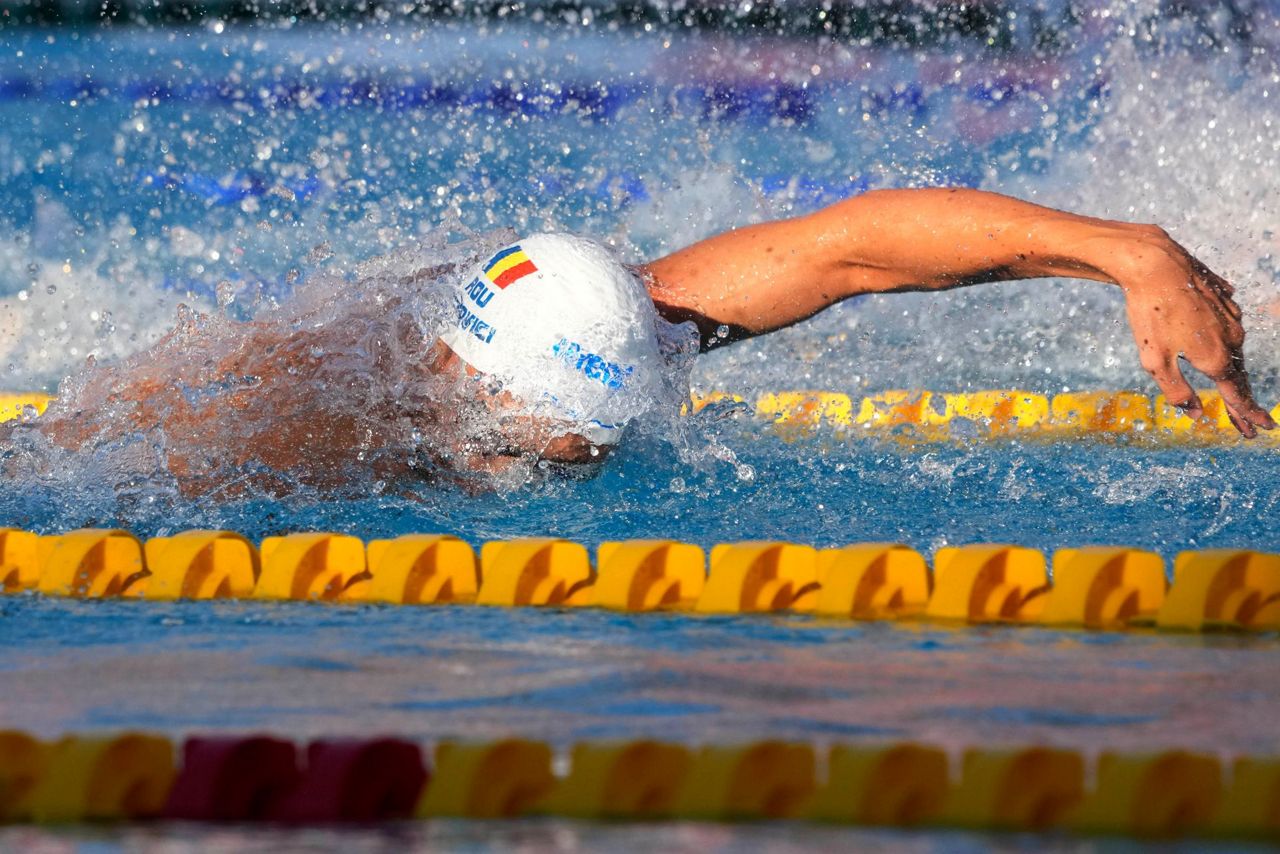 Romanian teen swimmer Popovici breaks 2009 mark in 100 free