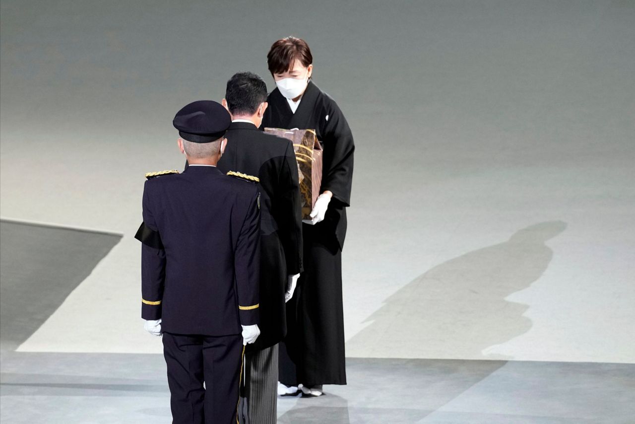Abe's militaristic funeral captures Japan's tense mood