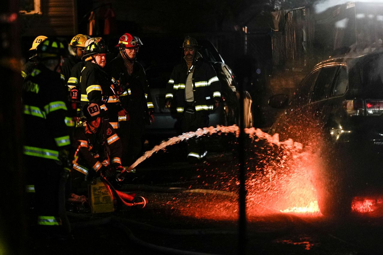 2 officers wounded by gunfire at home later seen on fire in ...