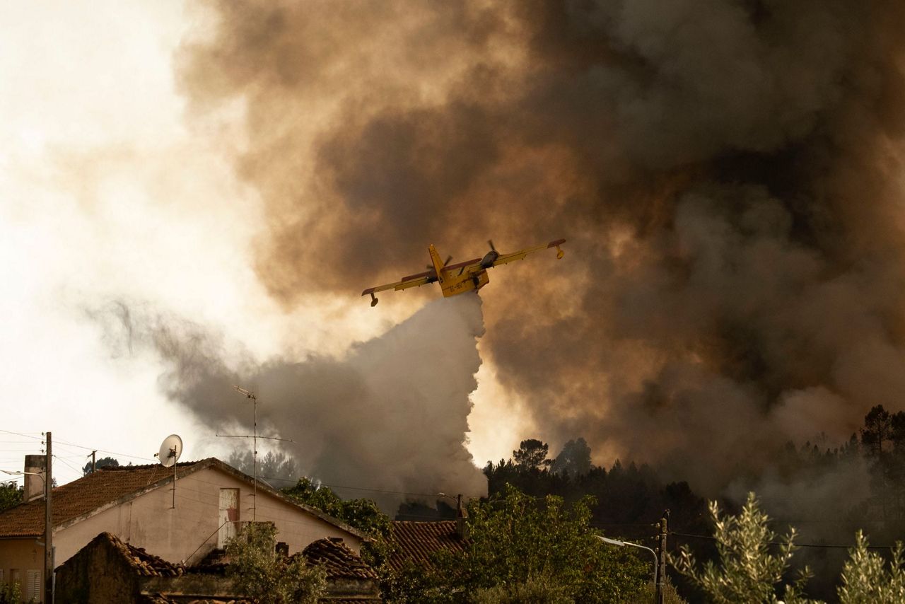 Firefighters battle wildfire in Portugal, 31 people hurt