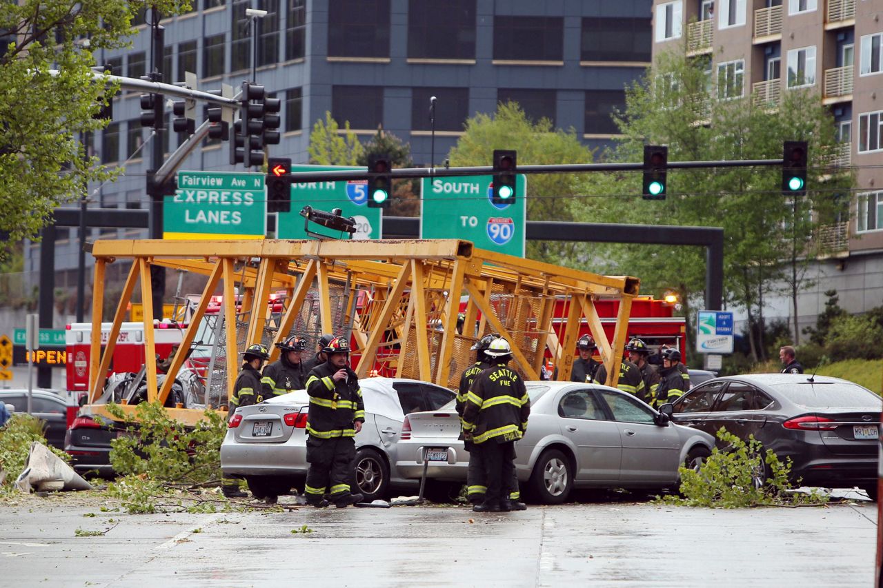The Latest: Crane collapses in downtown Seattle, kills 4