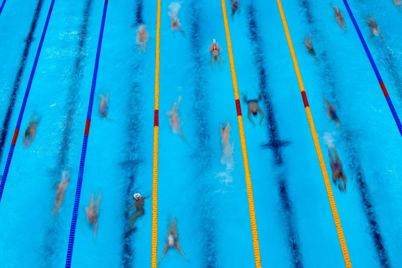 EXPLAINER: Olympic photos from far above — and underwater