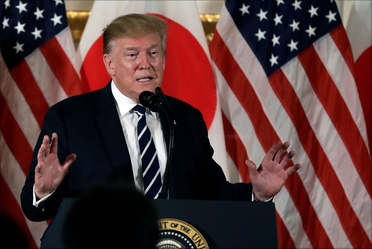 Japan welcomes Trump with a charm campaign, golf and sumo