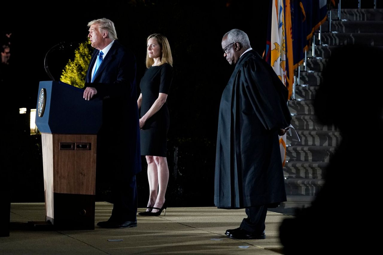 The Latest: Barrett takes 1st oath to join Supreme Court