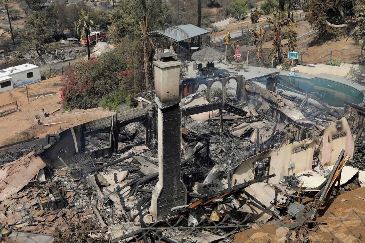 New wildfires sweep through California, burning homes