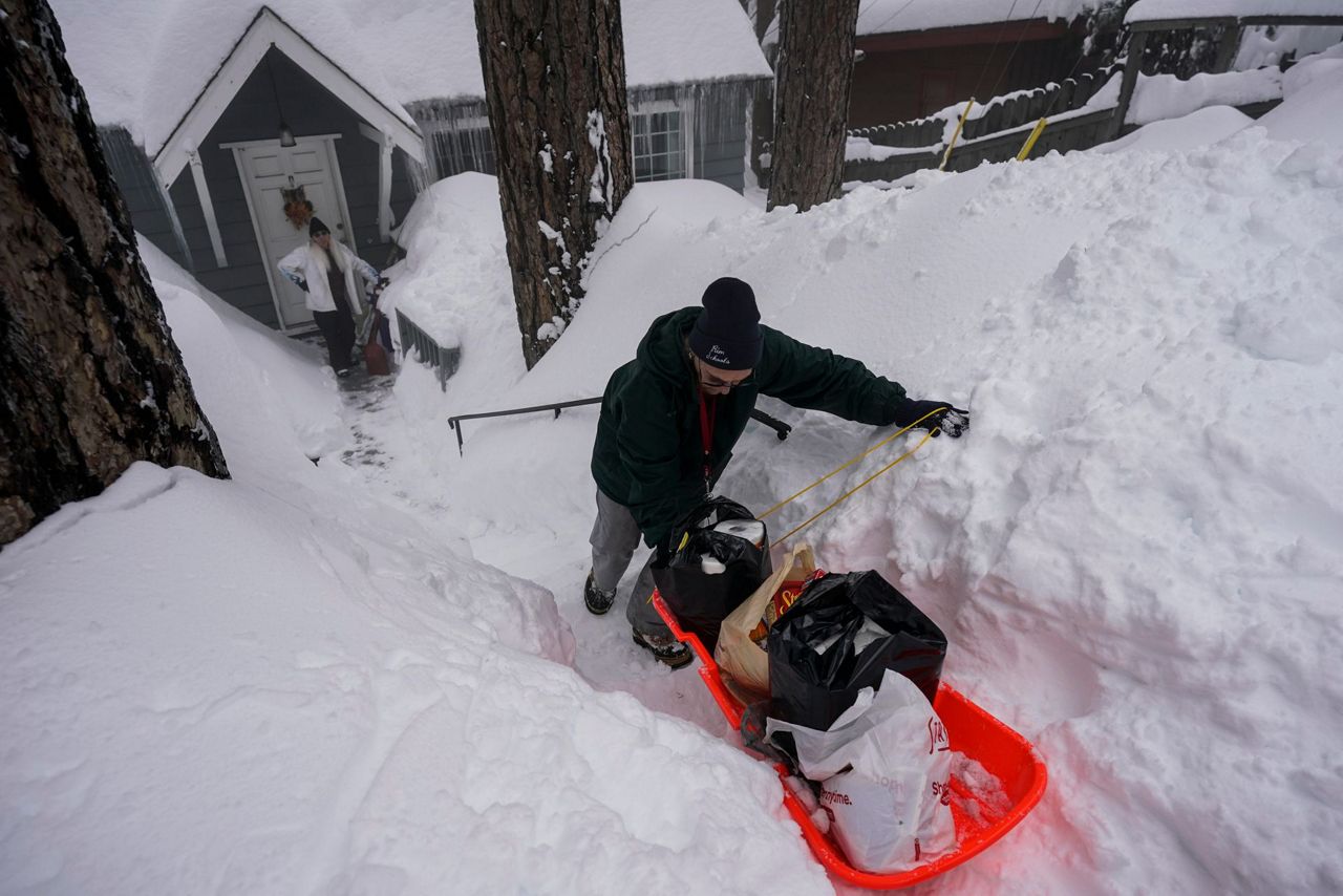 California, beleaguered by earlier storms, gets fresh snow