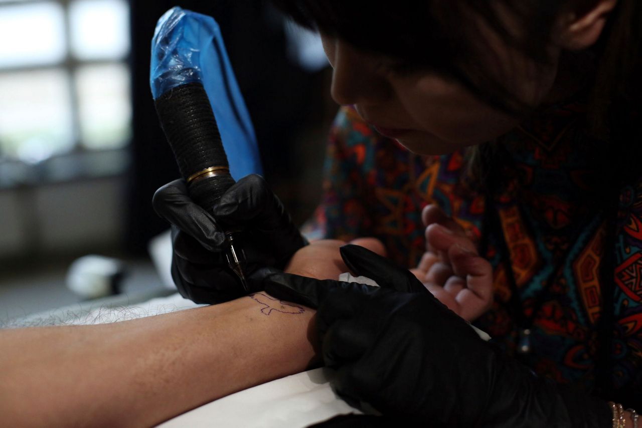 A tattoo at a time, Afghan woman takes on society’s taboos