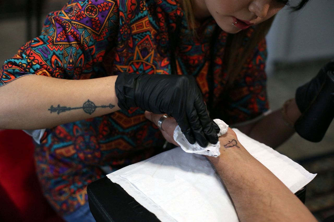 A tattoo at a time, Afghan woman takes on society’s taboos